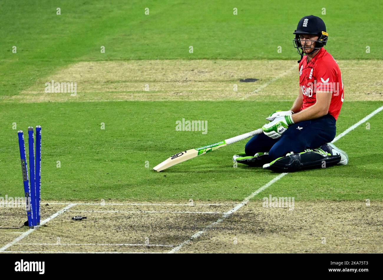 England's Jos Butler looks to his stumps after being run out during the ...