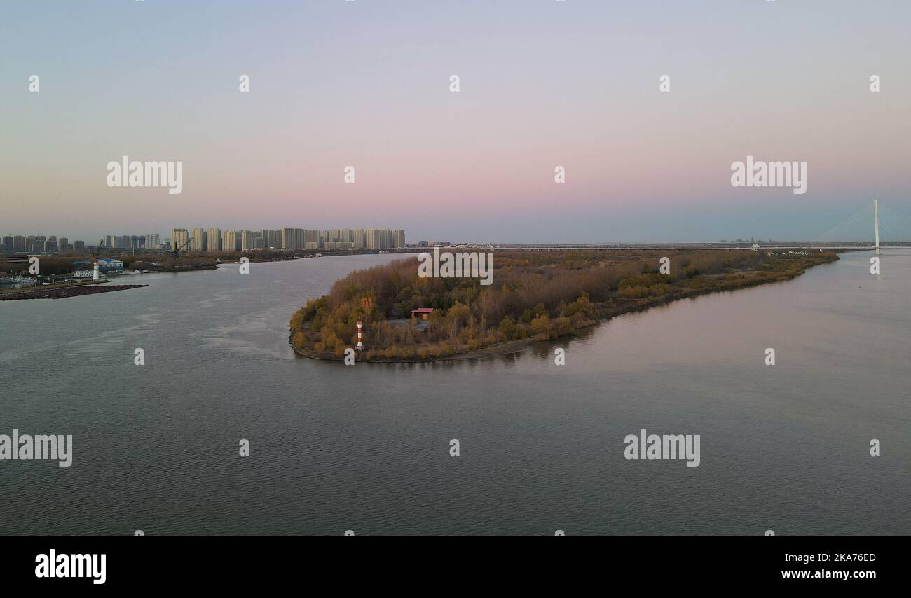 Aerial photos show evening city views on Songhua River in early winter ...