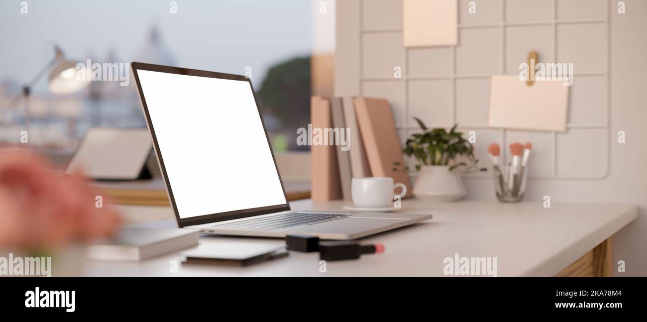 Minimal female office desk workspace against the window side view with ...