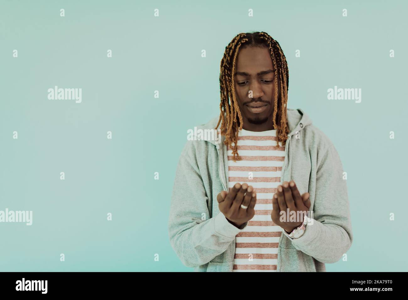 Young African Muslim Man Making Traditional Fatiha Prayer To Allah ...