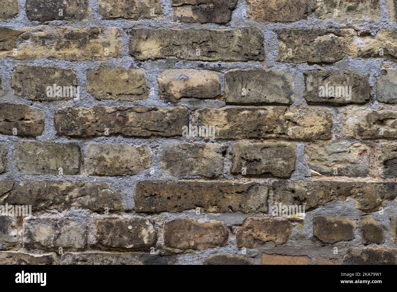 Old weathered beige brown brick wall background Stock Photo - Alamy