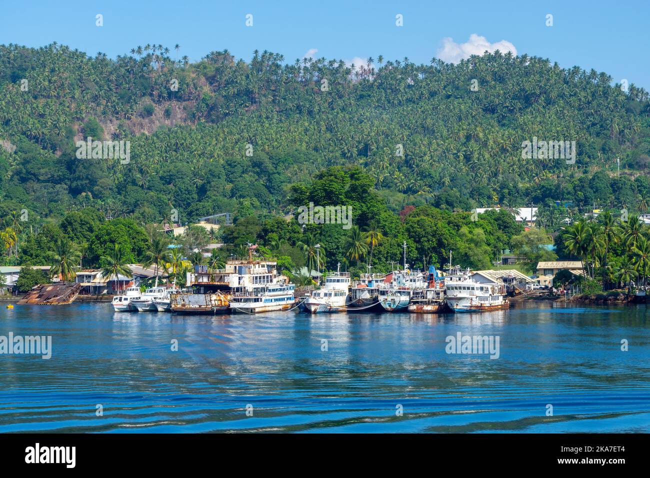 Boats moored against shoreline in Simpson Harbour, Karavia Bay, Rabaul ...