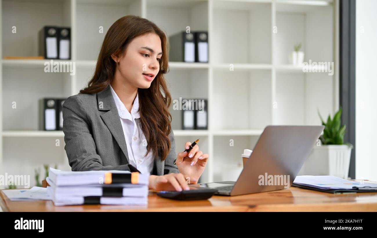 Professional millennial Caucasian businesswoman or female accountant in ...