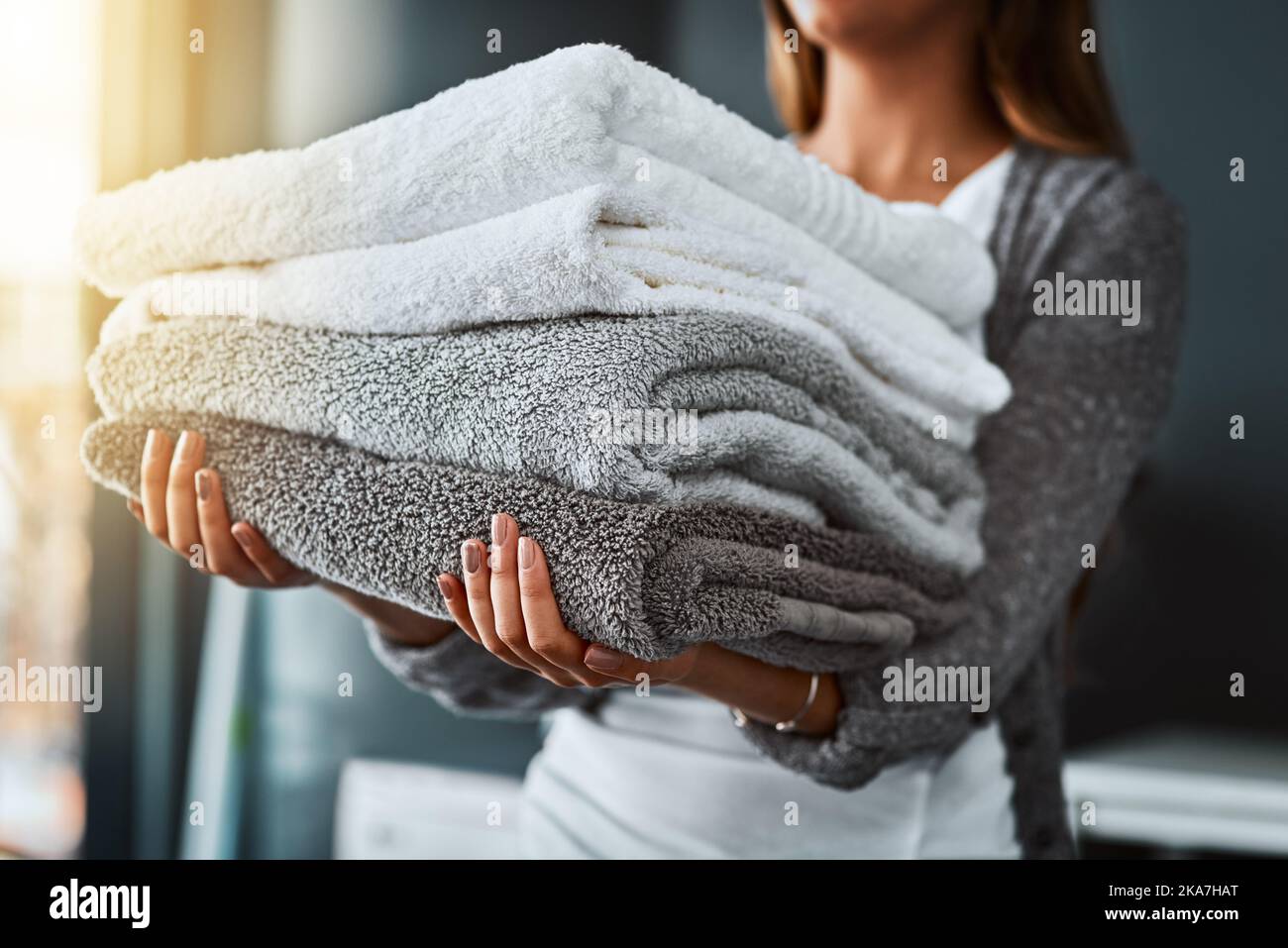 All folded, fresh and ready to be used. an unrecognizable woman doing ...