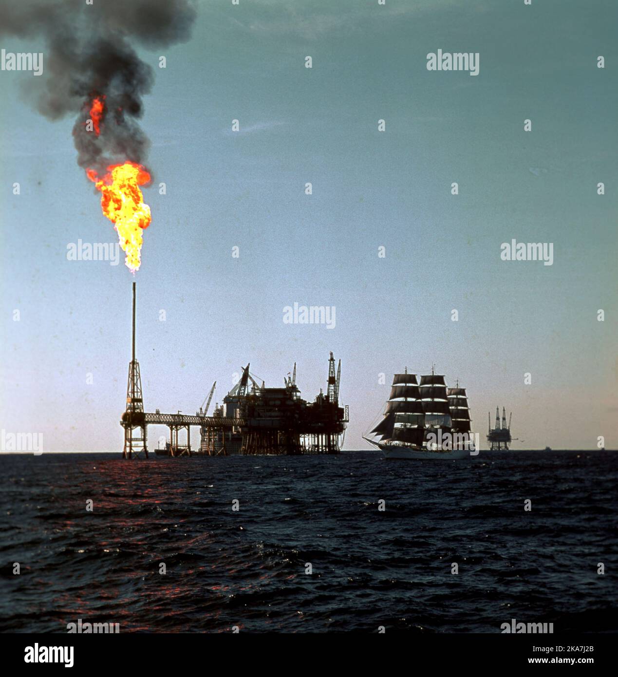 A sailing ship passes the Ekofisk oil platform in the North Sea Stock ...