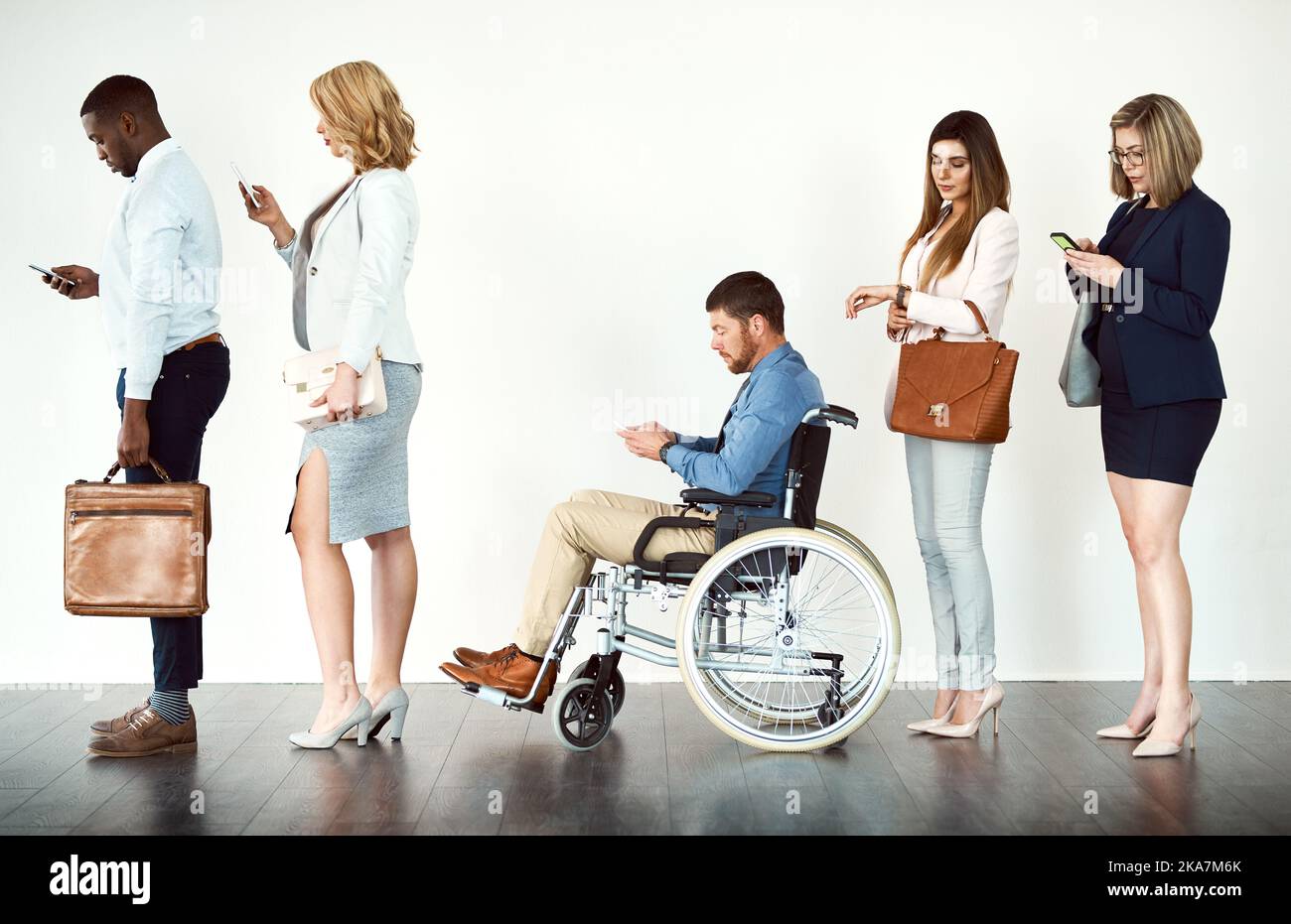 They are all patient people. Studio shot of a group o focused people in ...