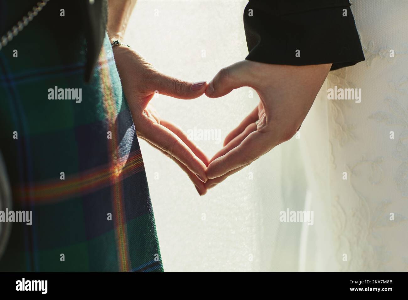 Together our love is strong. two unrecognizable people holding hands ...