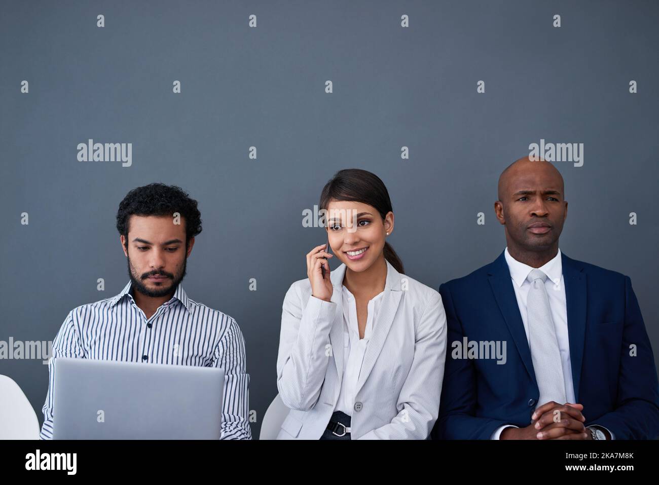 This call is keeping me preoccupied while I wait. Studio shot of ...