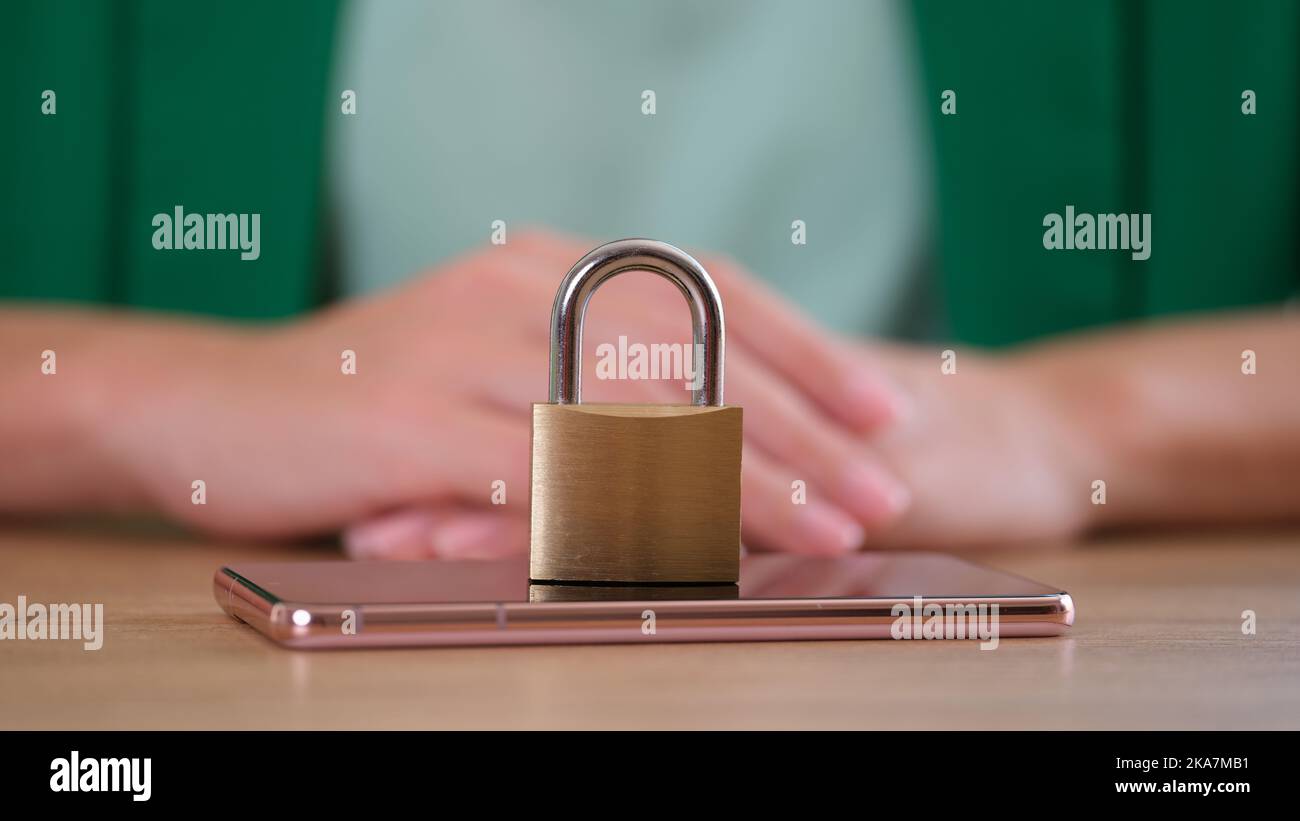 Closed metal lock on modern smartphone, mobile phone security Stock ...