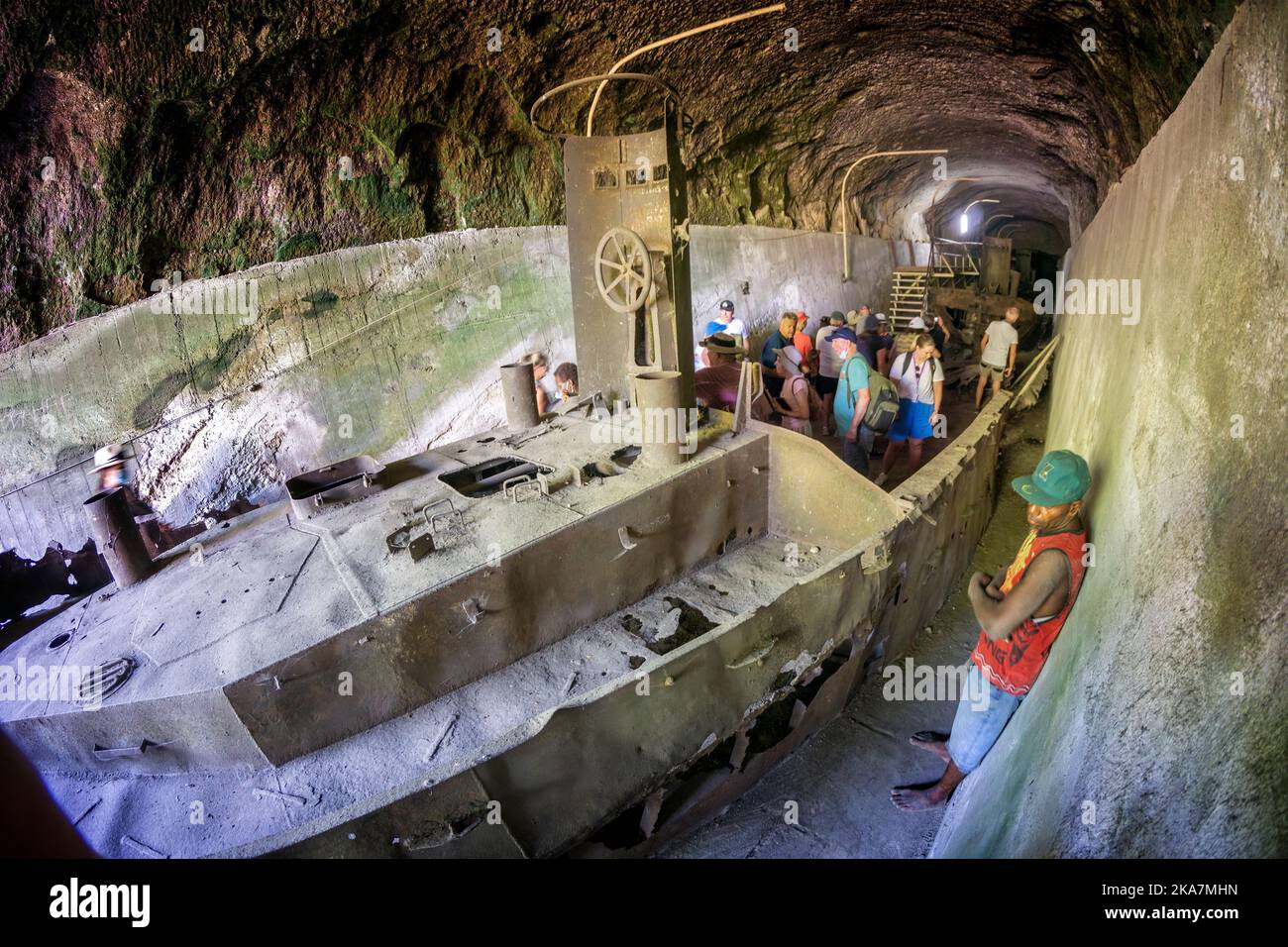 Tourists visiting remains of WWII Japanese transport barge in barge ...