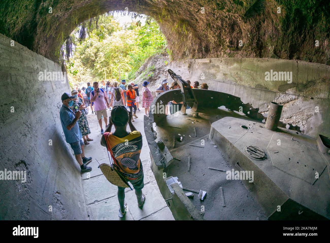 Tourists visiting remains of WWII Japanese transport barge in barge ...