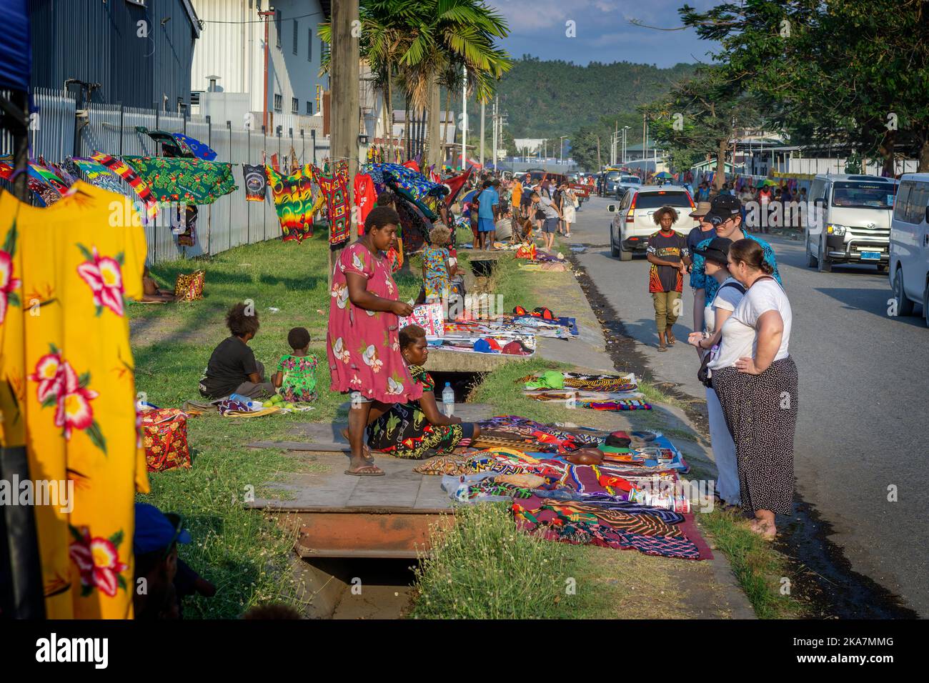 Cruise ship tourists buying goods at open air market on street outside ...