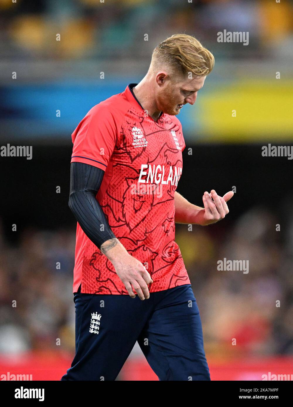 England's Ben Stokes of England looks at his hand after catching out ...