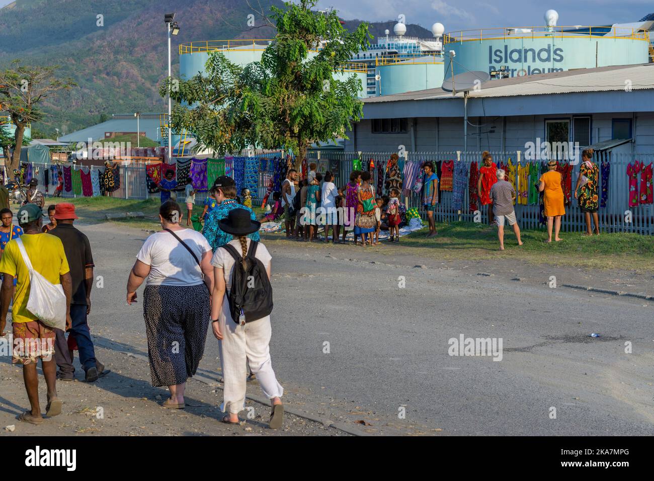 Cruise ship tourists buying goods at open air market on street outside ...