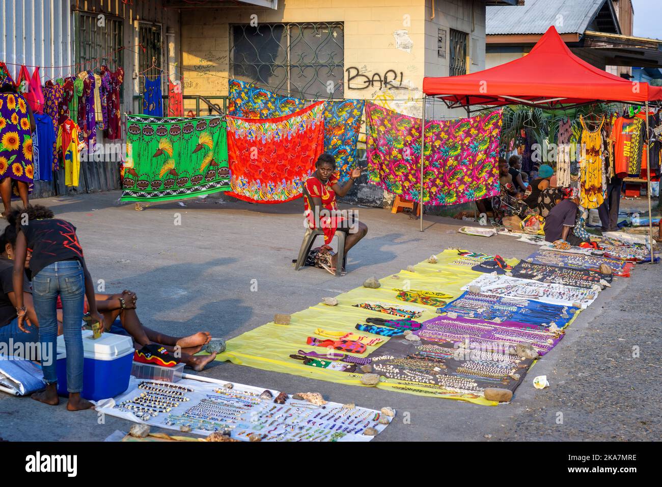 Cruise ship tourists buying goods at open air market on street outside ...