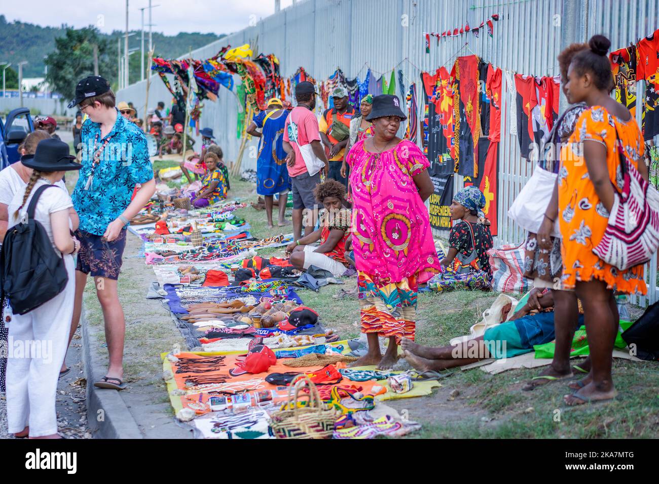 Cruise ship tourists buying goods at open air market on street outside ...