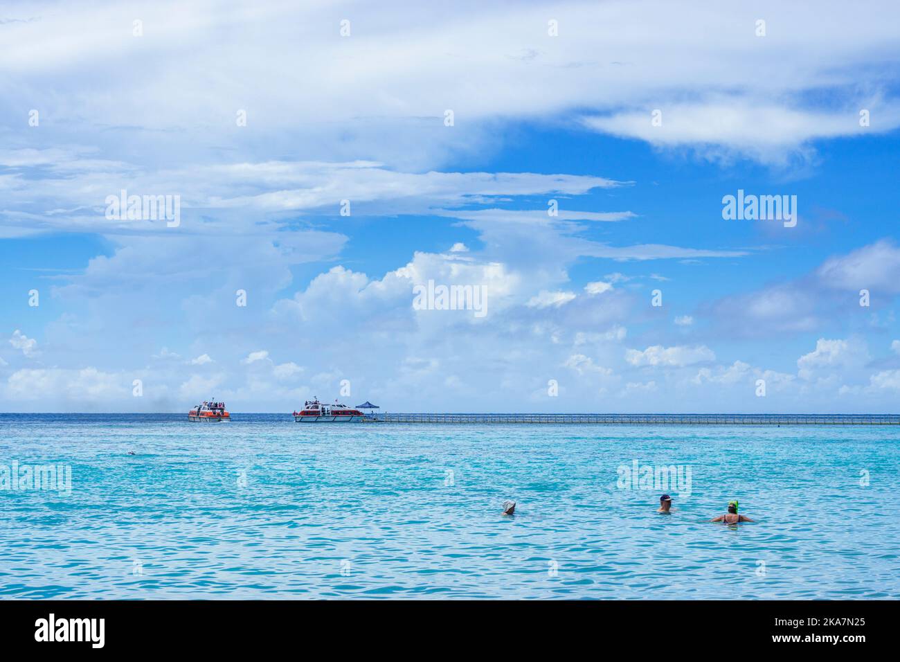 People swimming in water with small tenders from cruise ship in the ...