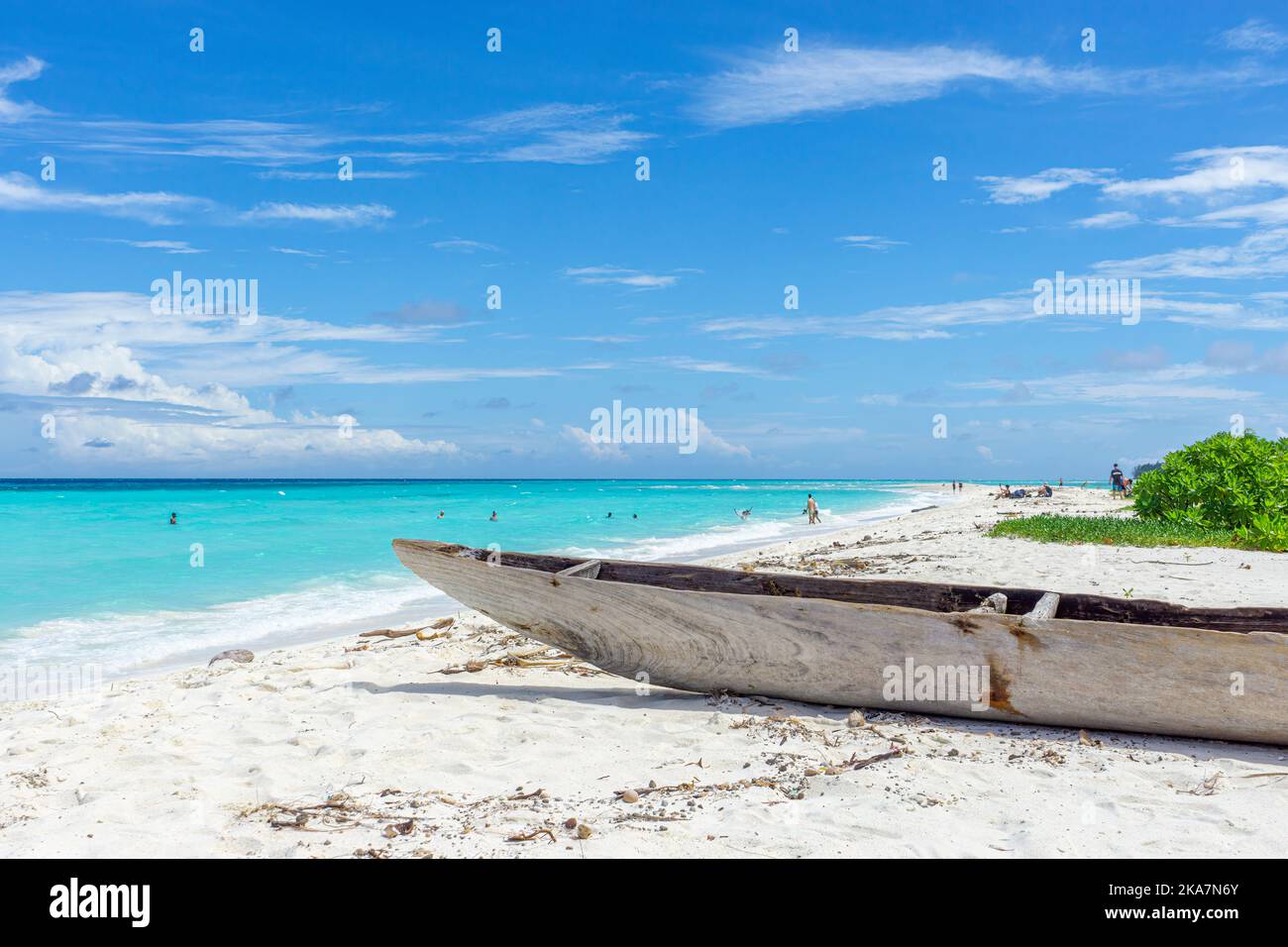 Dugout canoe on white sandy beach on summers day, Conflict Islands ...