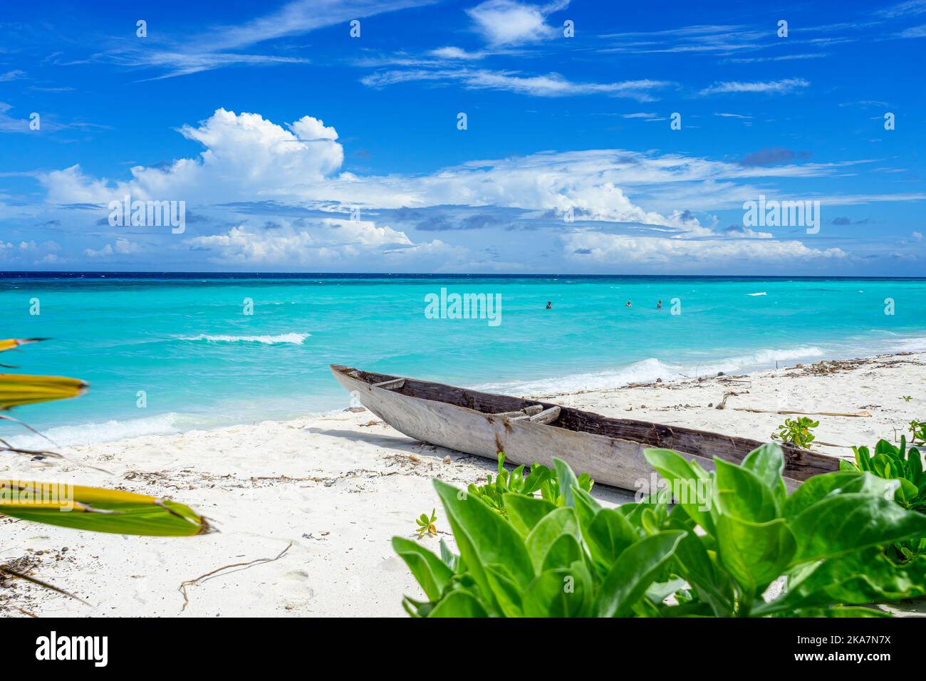 Dugout canoe on white sandy beach on summers day, Conflict Islands ...