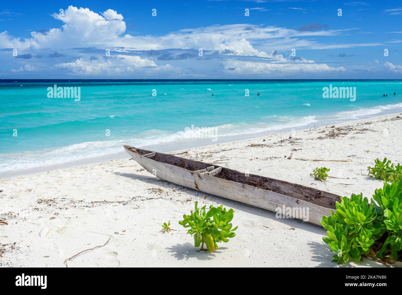 Dugout canoe on white sandy beach on summers day, Conflict Islands ...