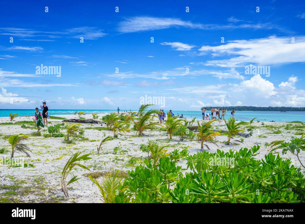 Tourists on white sandy beach on summers day, Conflict Islands, Papua ...