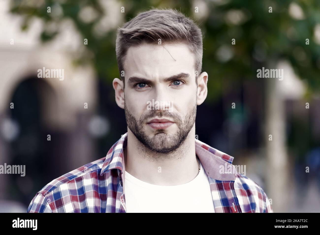 Feeling new skin. Handsome man with unshaven face summer outdoors ...