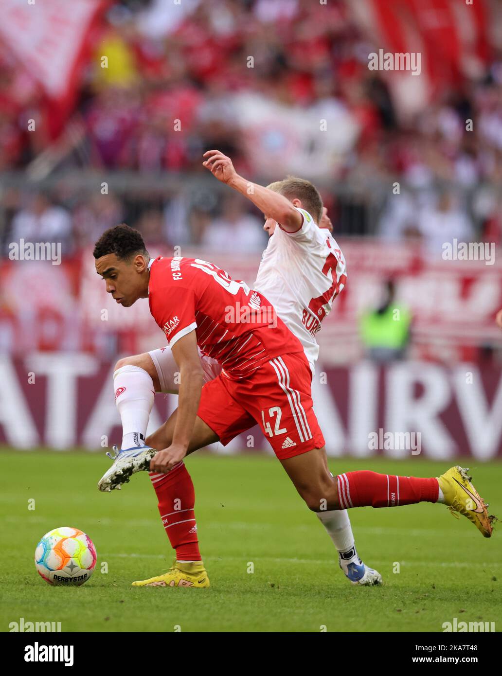 Jamal Musiala of Bayern Muenchen Jonathan Burkhardt of FSV Mainz 05 ...