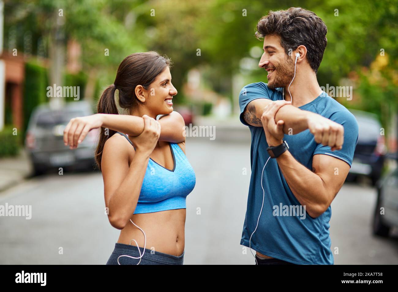 First we start with a good few stretches. a sporty young couple ...