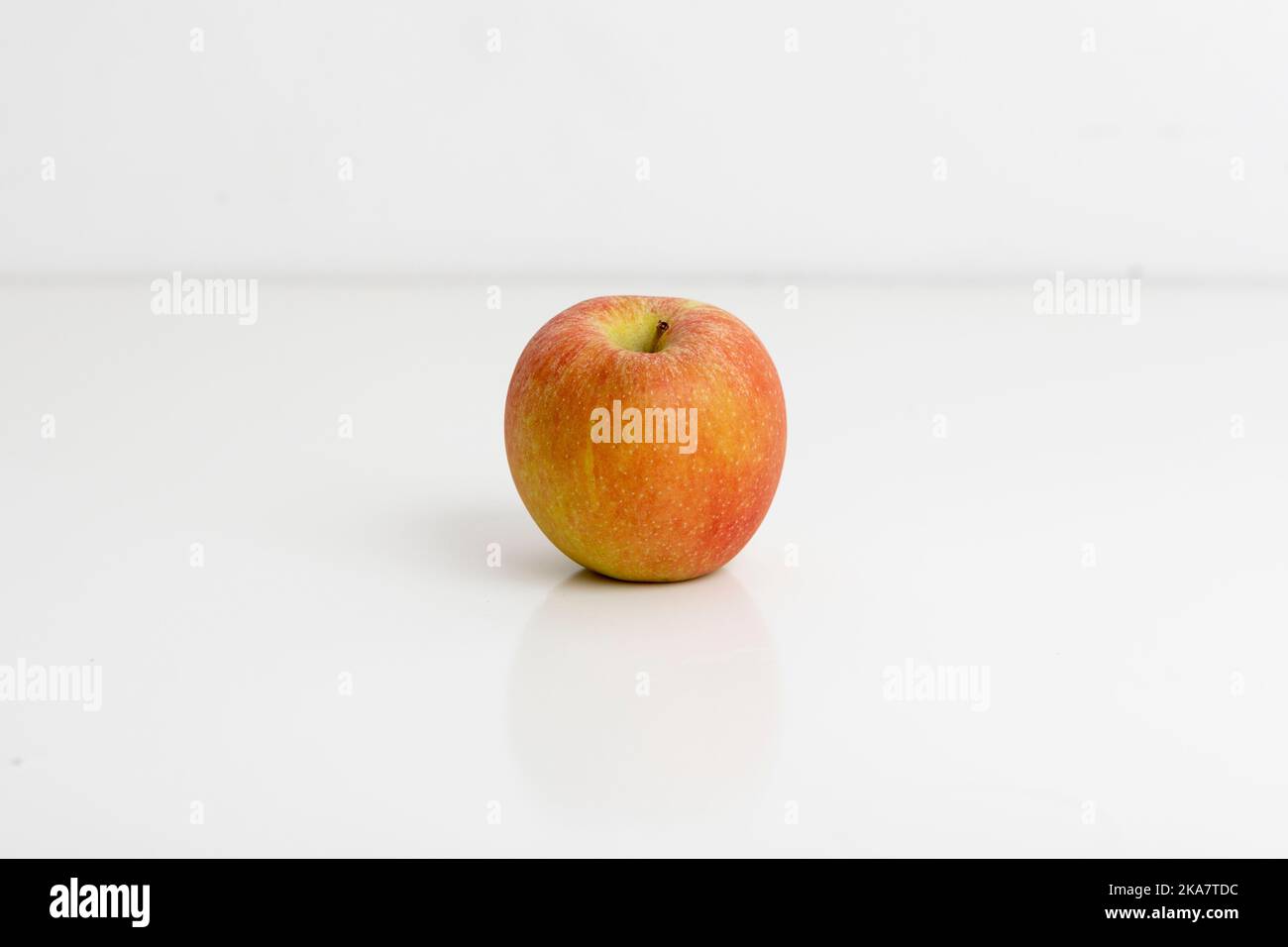 An apple photographed against a plain white background Stock Photo - Alamy