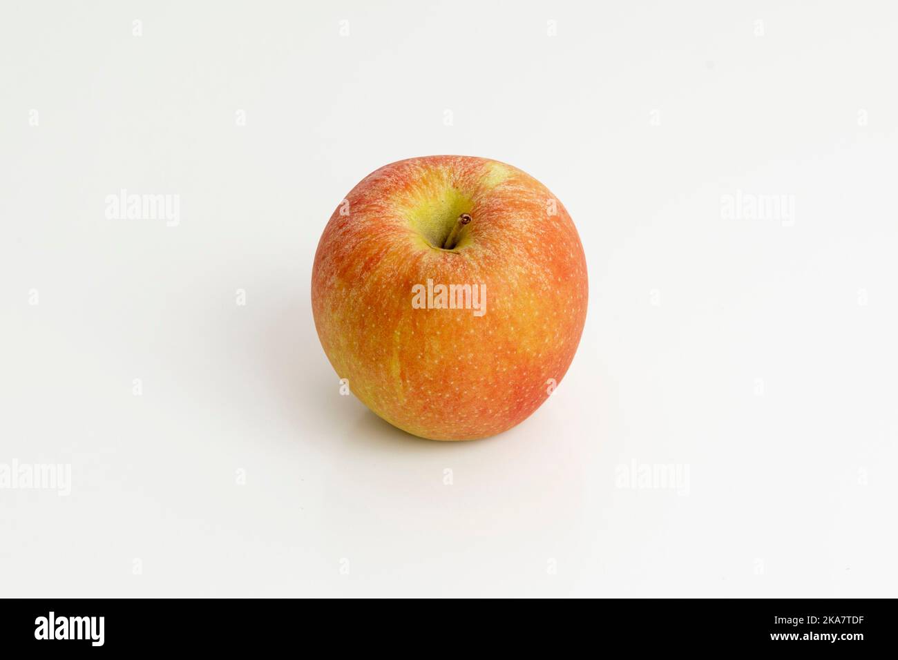 An apple photographed against a plain white background Stock Photo - Alamy