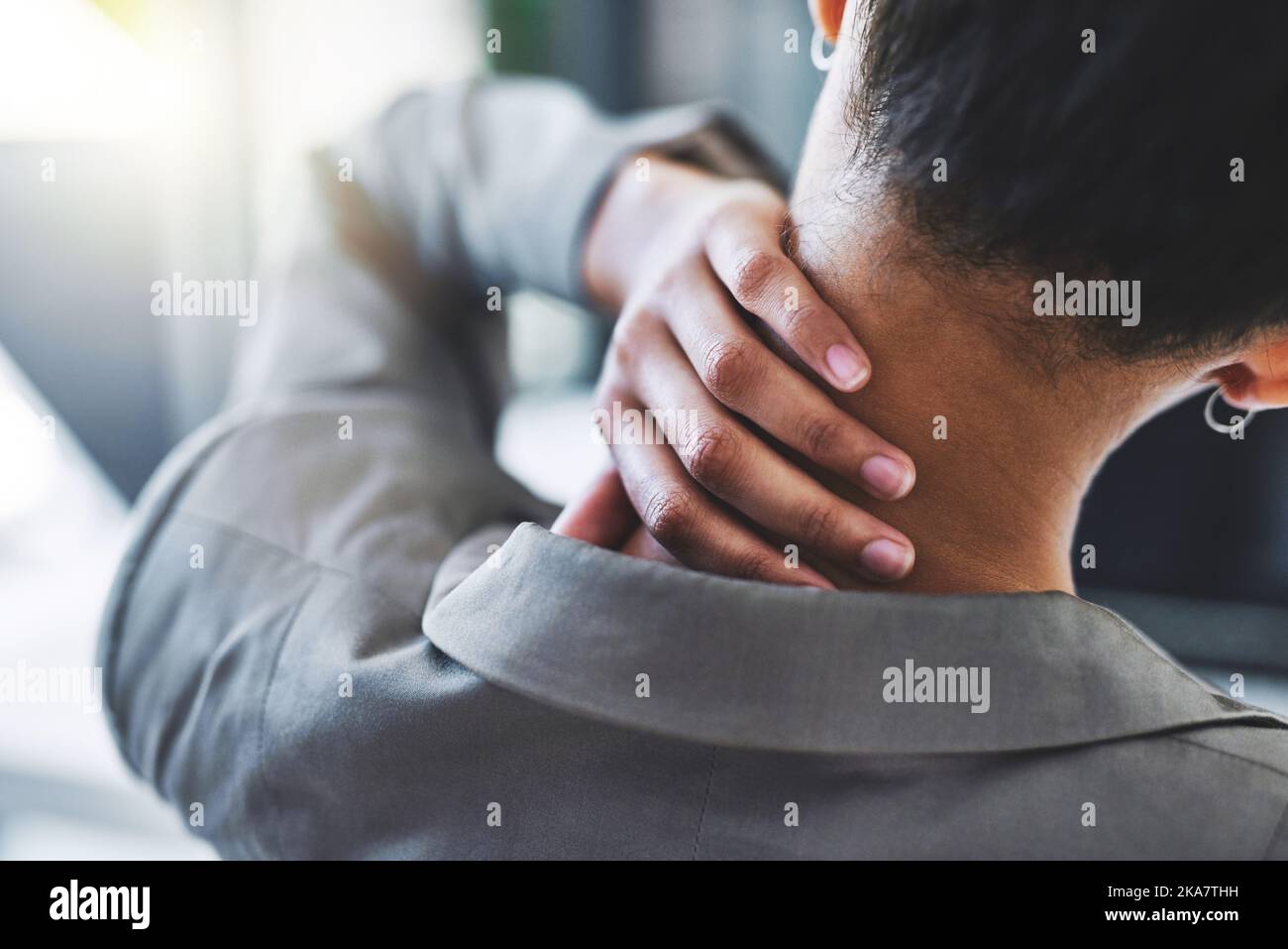 Feeling the strain of the day. an unrecognizable businesswoman ...