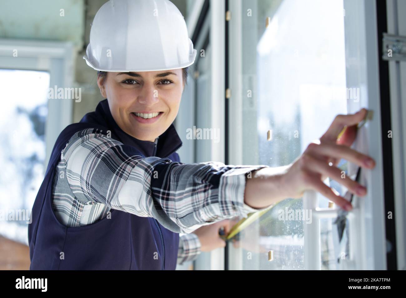 female worker measure the window Stock Photo - Alamy