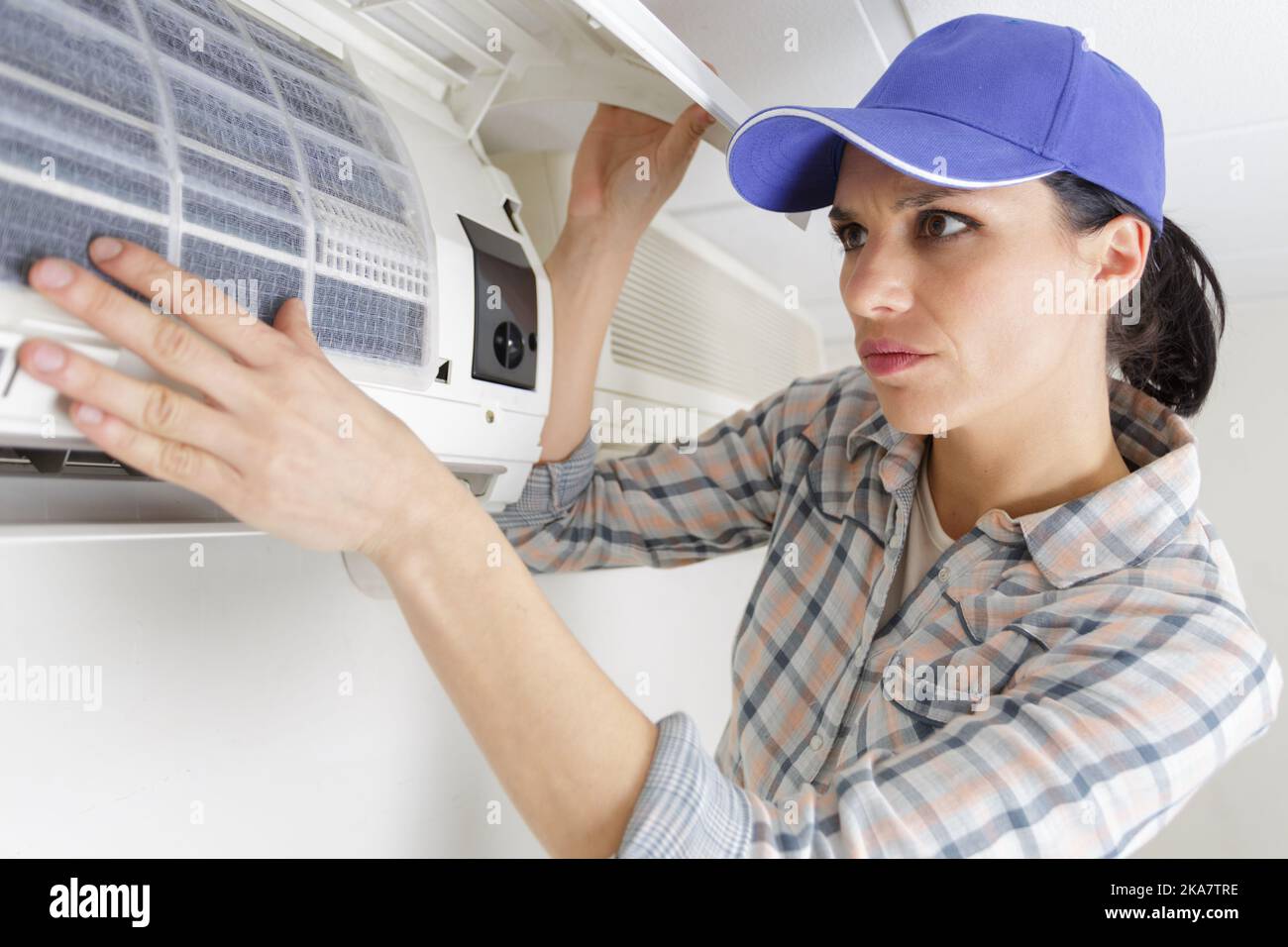 Woman cleaning air conditioner hi-res stock photography and images - Alamy