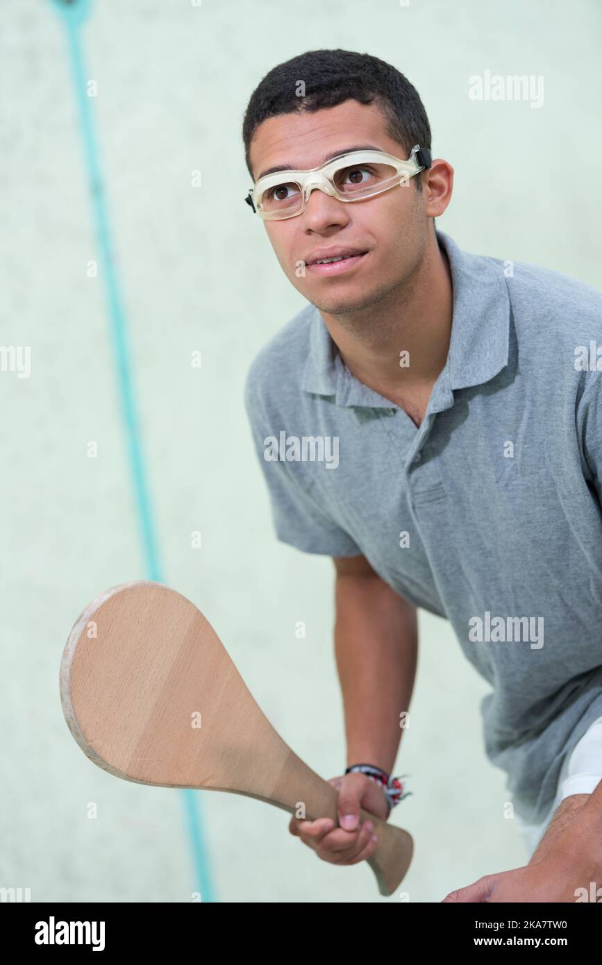 young man squash player exercise game in the gym Stock Photo - Alamy