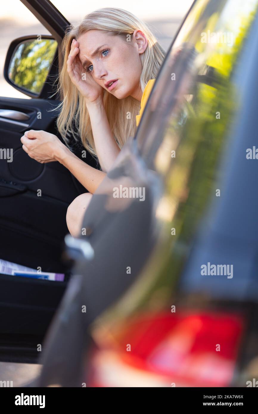 worried woman sat in her car Stock Photo - Alamy