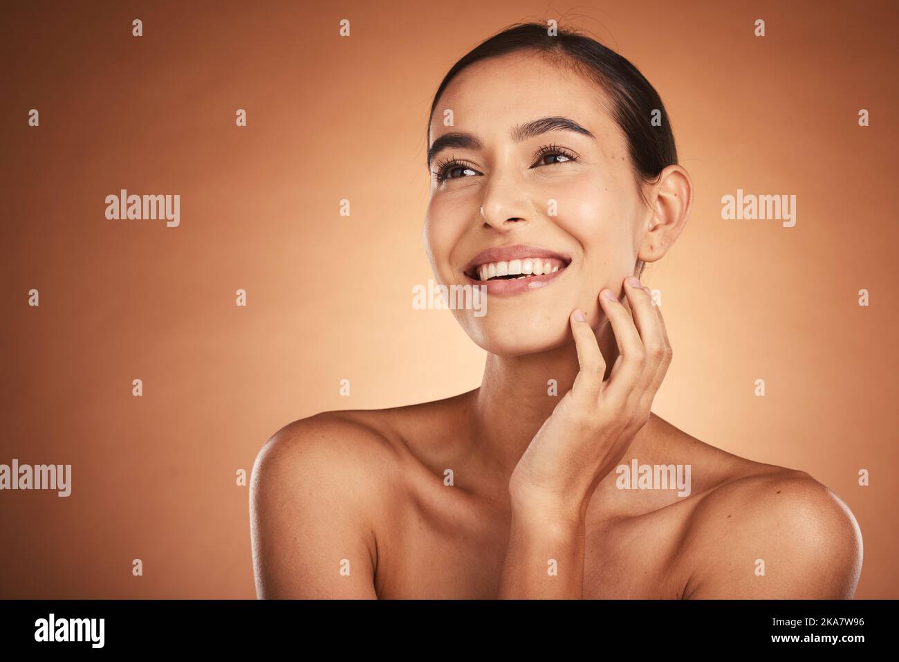 Thinking, beauty and skincare of hispanic woman against a brown studio ...