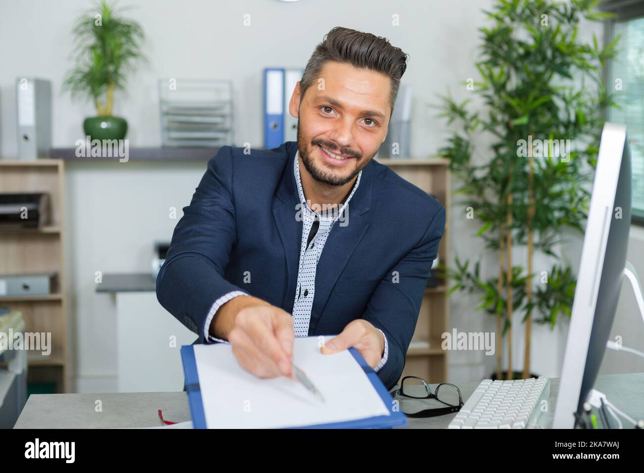 Successful signature sitting hi-res stock photography and images - Alamy