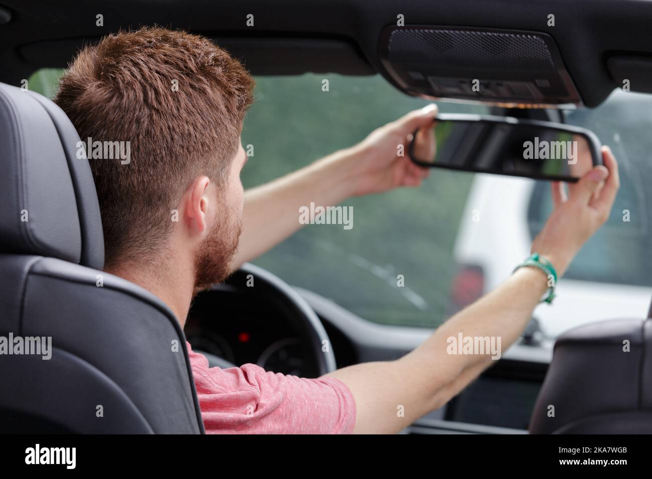 Man adjusting rear view mirror car hi-res stock photography and images ...