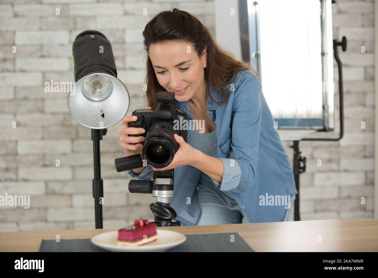 a woman vlogger taking a picture Stock Photo - Alamy
