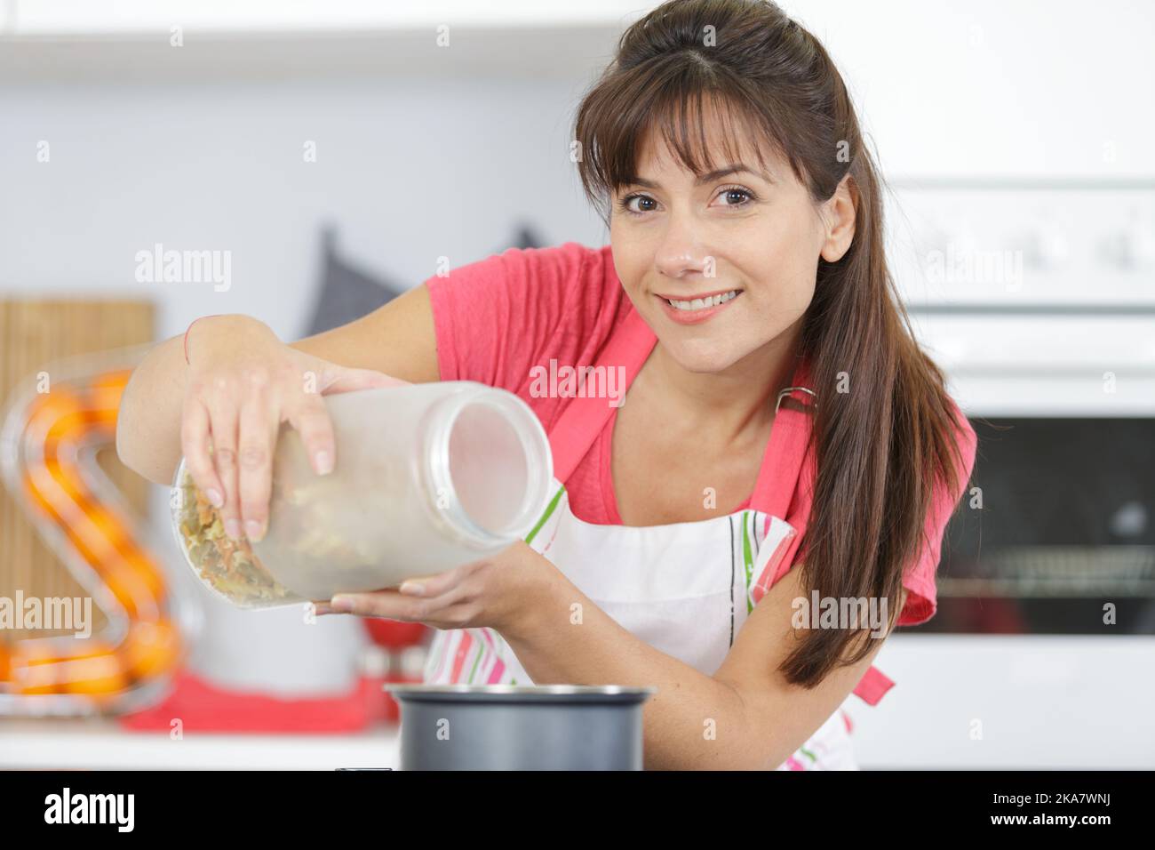 Woman eating vegetables pasta in hi-res stock photography and images ...