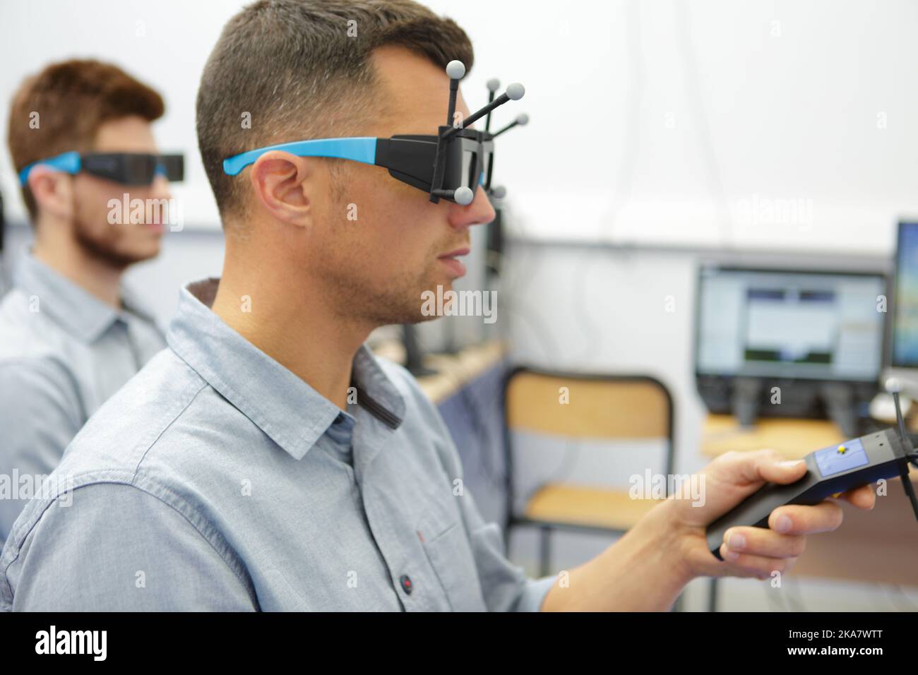 Two men play virtual reality hi-res stock photography and images - Alamy