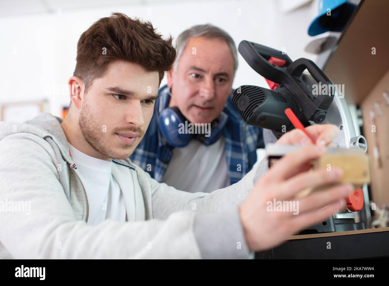two men checking new industrial processing equipment Stock Photo - Alamy