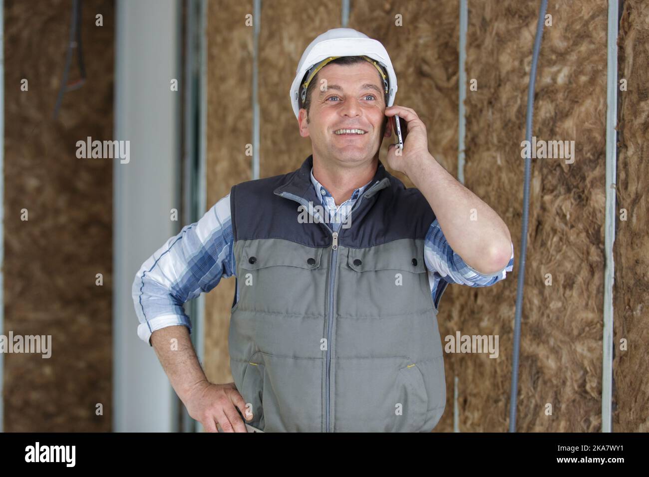 repairman on the phone with his work Stock Photo - Alamy
