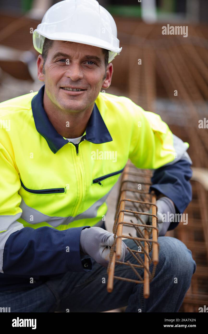 worker building a house at construction site Stock Photo - Alamy