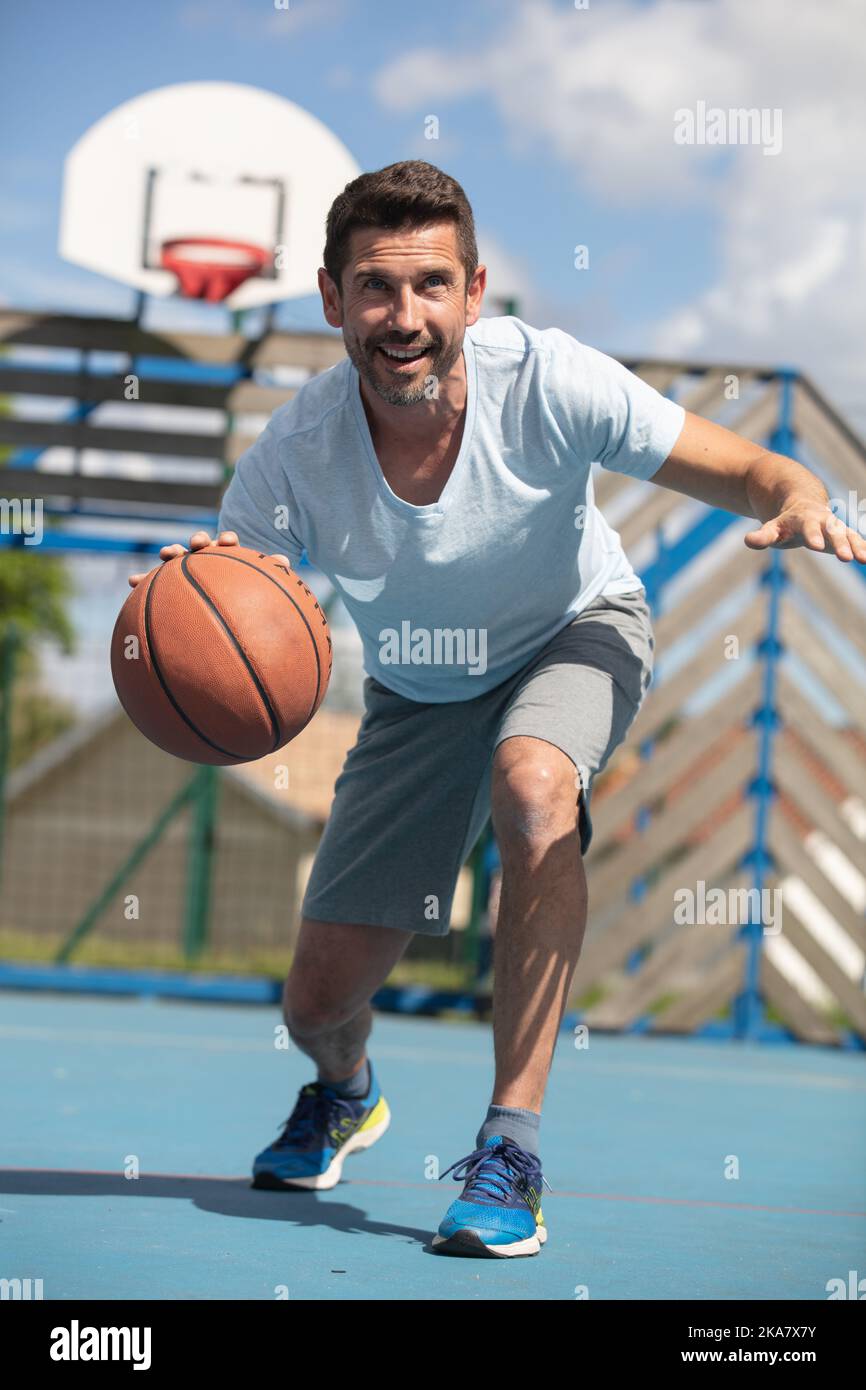 fit male playing basketball outdoor Stock Photo - Alamy