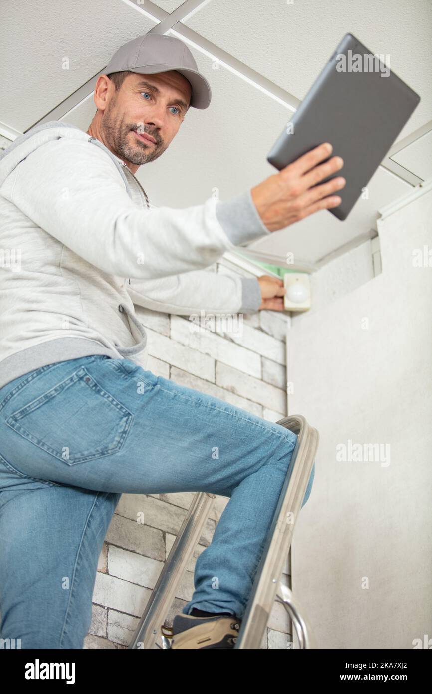 surveyor with digital tablet carrying out house inspection Stock Photo ...