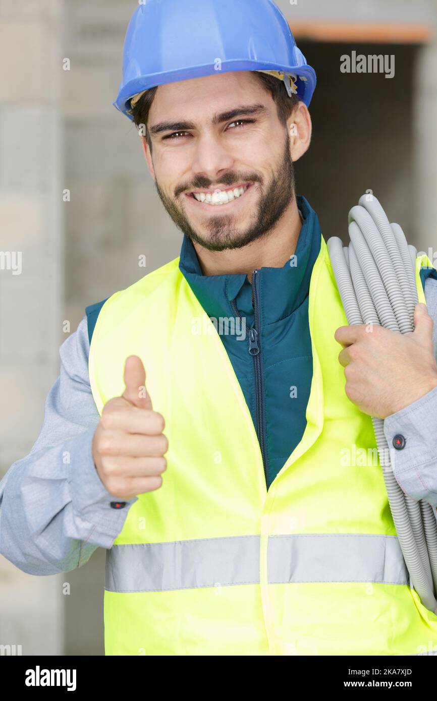 optimistic worker shows thumb up Stock Photo - Alamy optimistic worker shows thumb up Stock Photo - Alamy