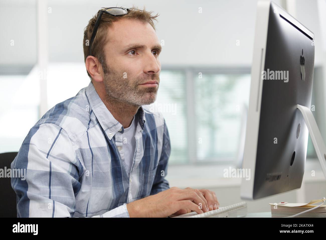 a busy man in office Stock Photo - Alamy