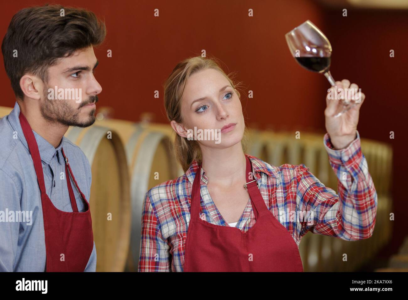 portrait of man and woman winery workers in cellar Stock Photo - Alamy