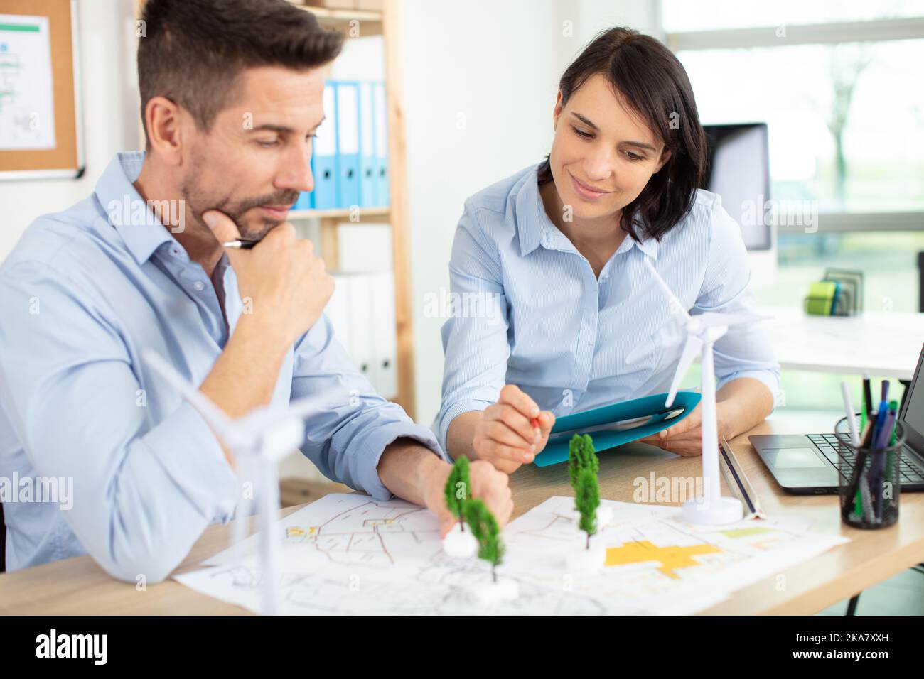 Group young architects model house hi-res stock photography and images ...